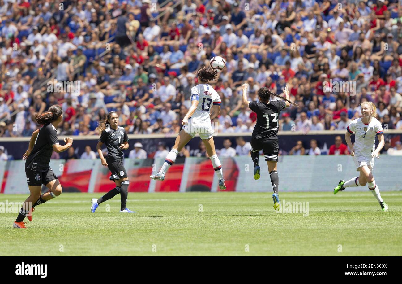 Alex Morgan (13) of USA passess ball during friendly game against ...