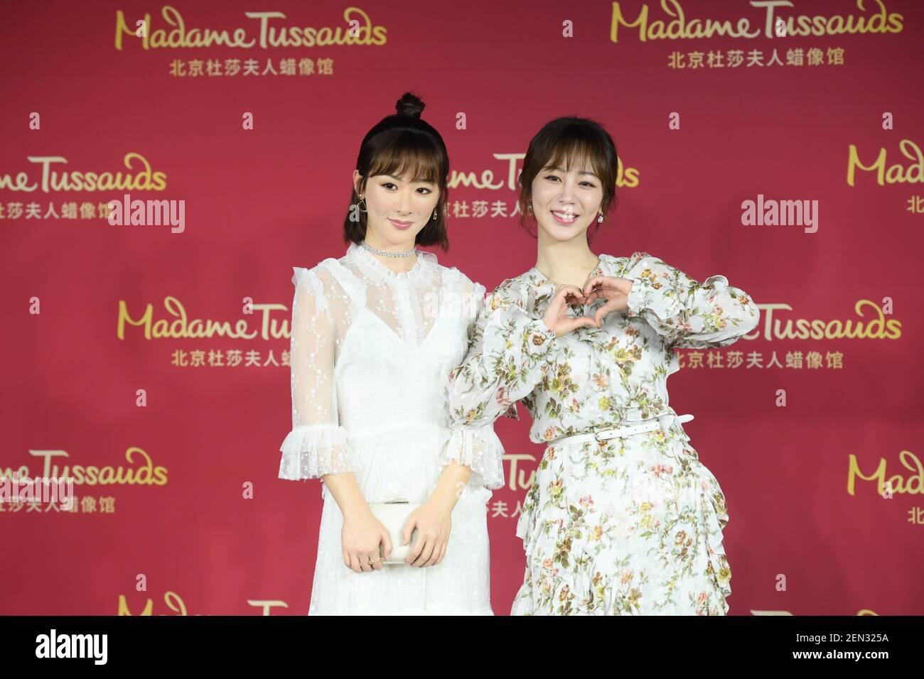 Chinese actress Andy Yang or Yang Zi poses with the wax figure of her ...