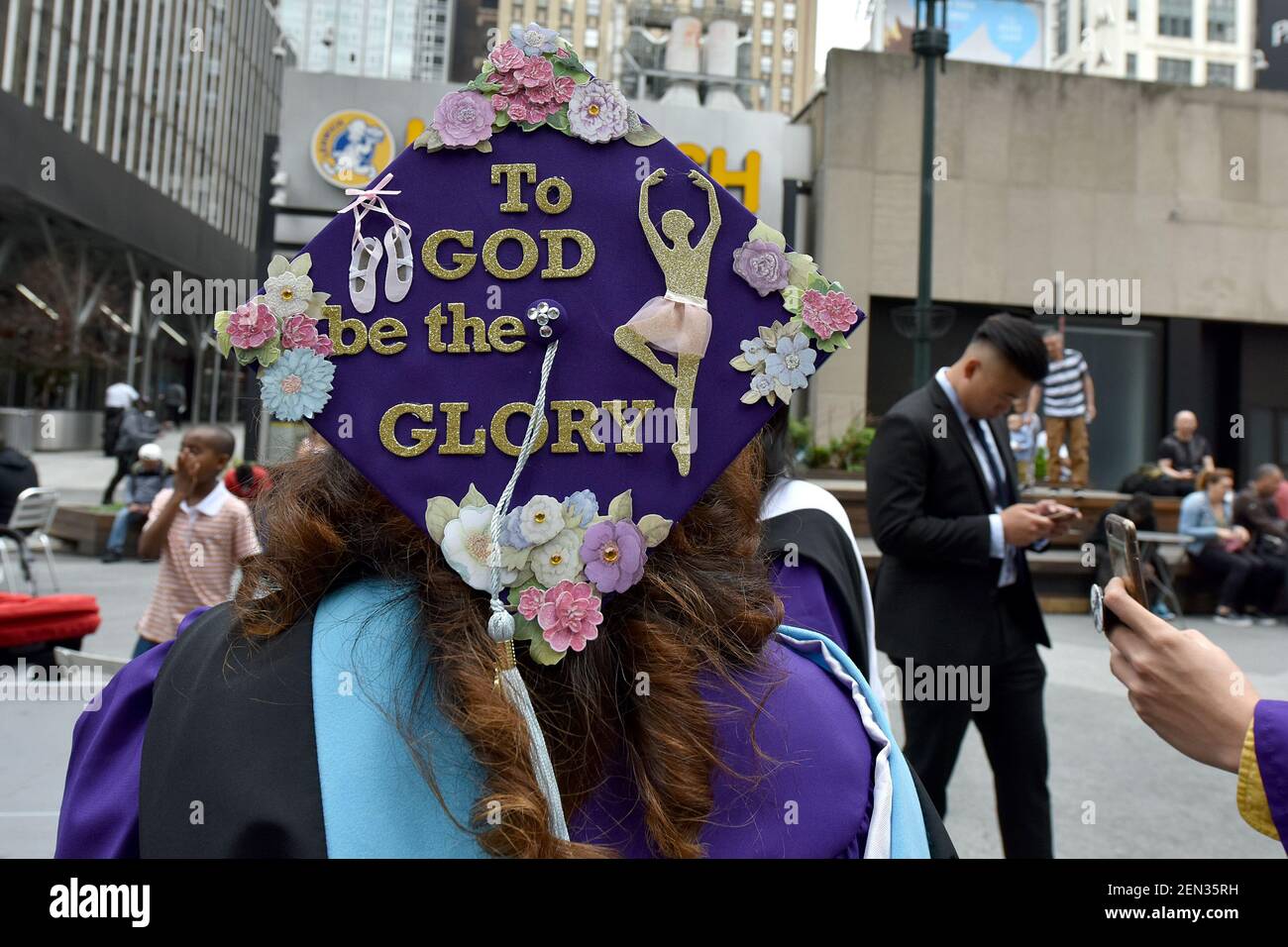 A member of the 2019 graduating class of Hunter College wears a hand ...