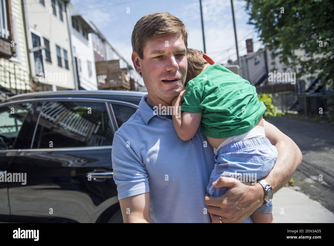 UNITED STATES - MAY 30: Rep. Eric Swalwell, D-Calif., carries his son ...
