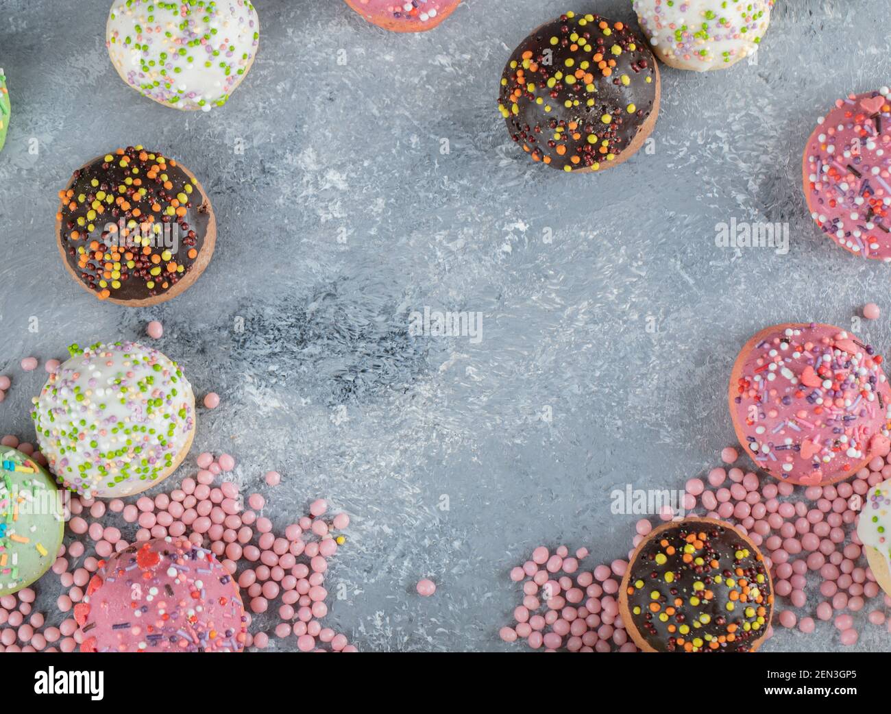 Colorful cookies decorated with sprinkles on marble background Stock ...