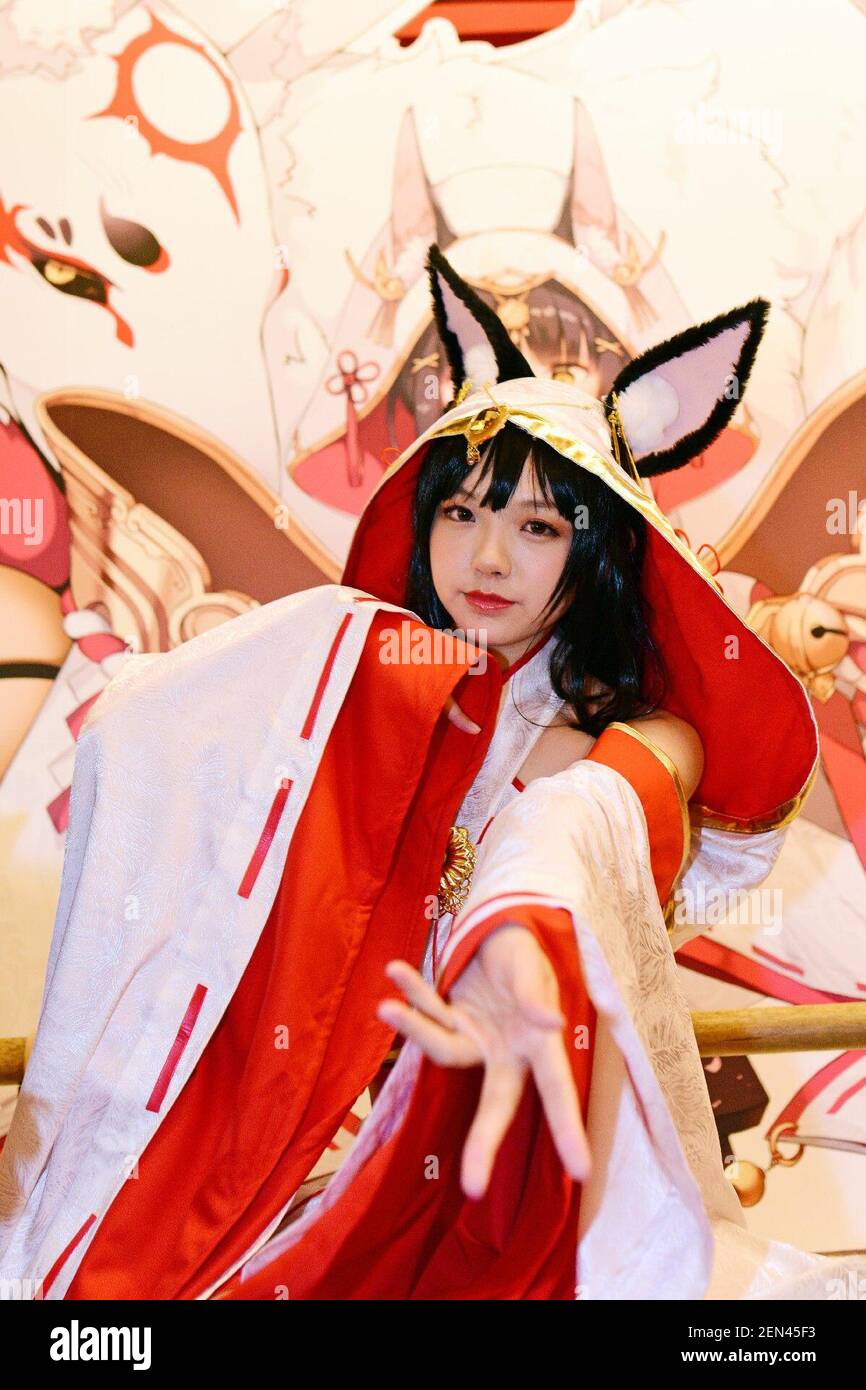 An entertainer dressed in cosplay costume featuring characters of side ...