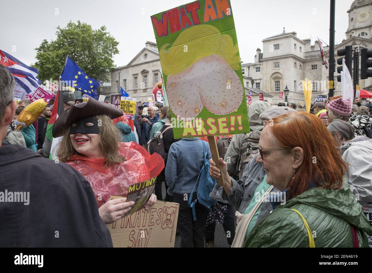 A demonstrators with colourful placard takes part during the anti-Trump ...