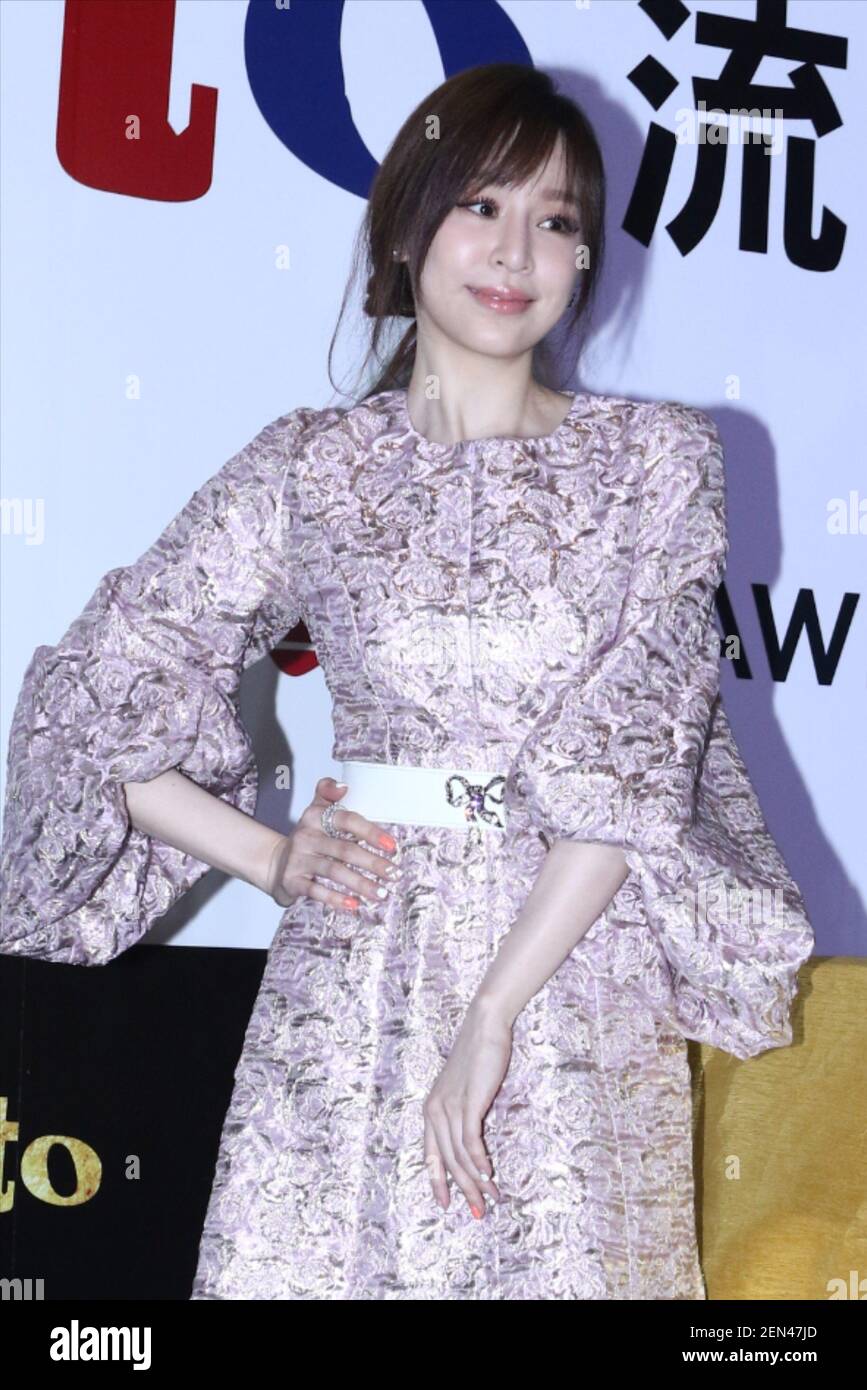 Taiwanese singer and actress Cyndi Wang poses with her trophies during ...