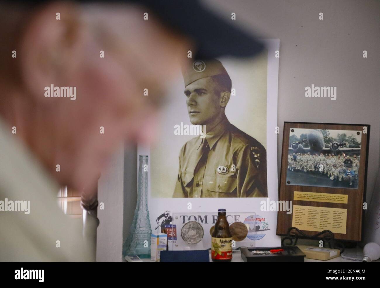 Tom Rice in the foreground, with a photo board of him in the background ...