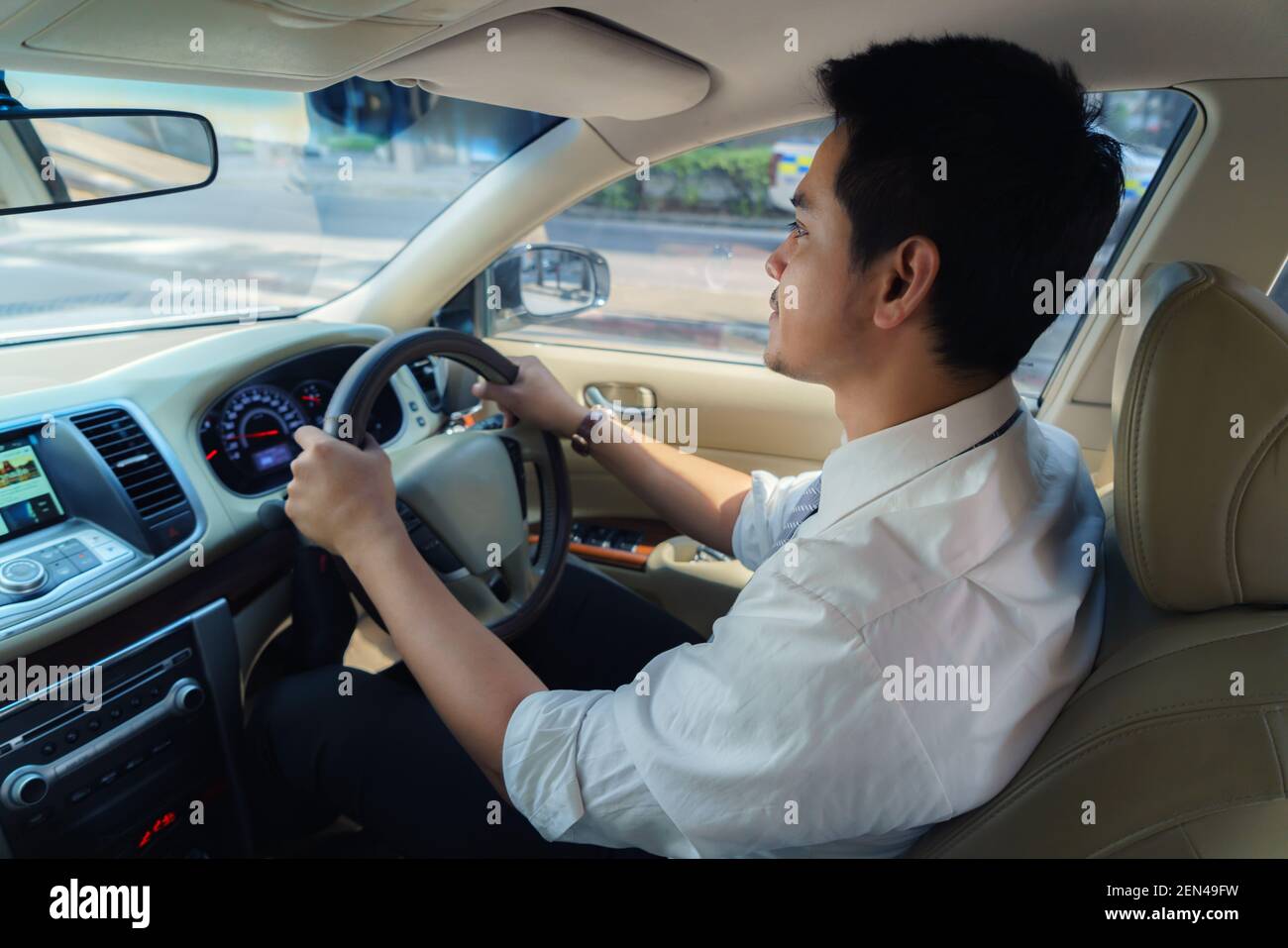 Asian businessman driving car hi-res stock photography and images - Alamy