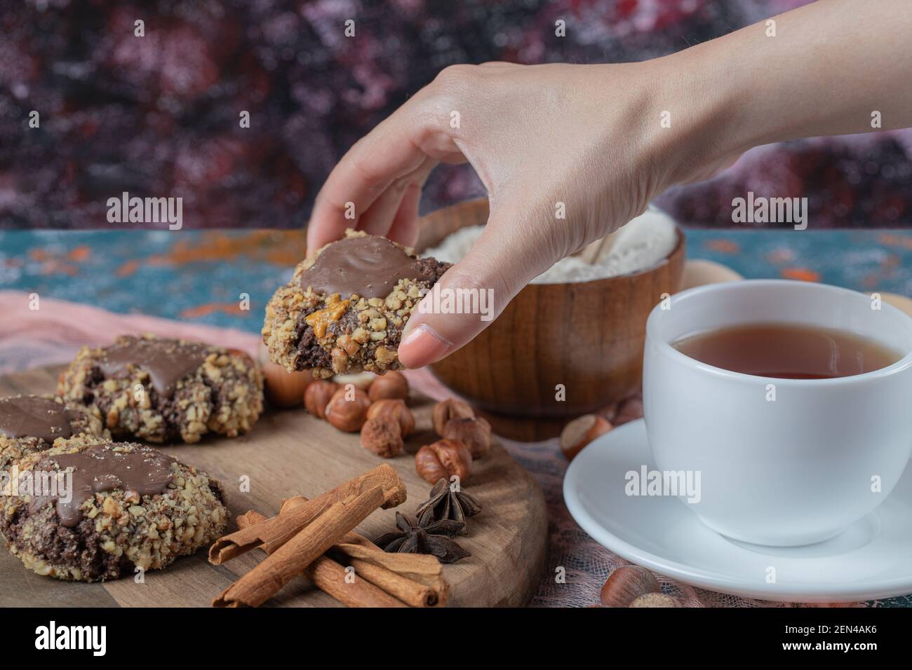 Chocolate crocante cookies with cinnamon flavour and a cup of tea Stock ...