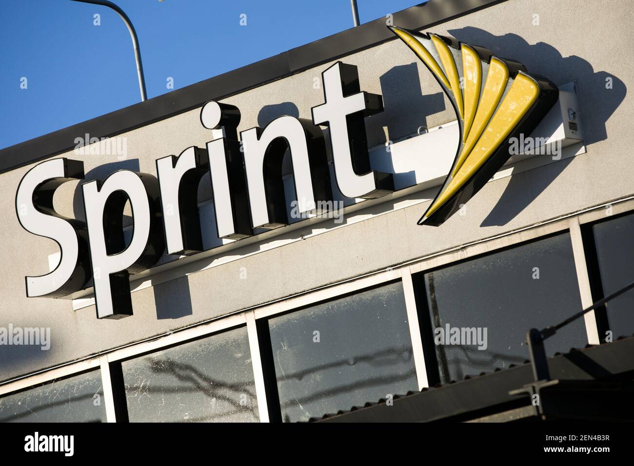 A logo sign outside of a Sprint Corporation retail store location in ...