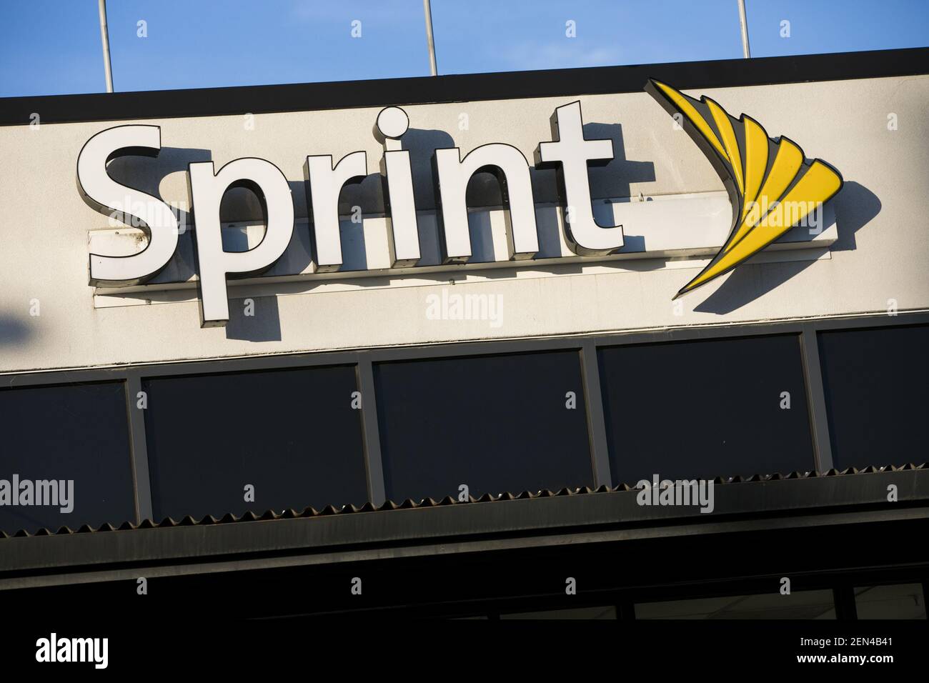 A logo sign outside of a Sprint Corporation retail store location in ...