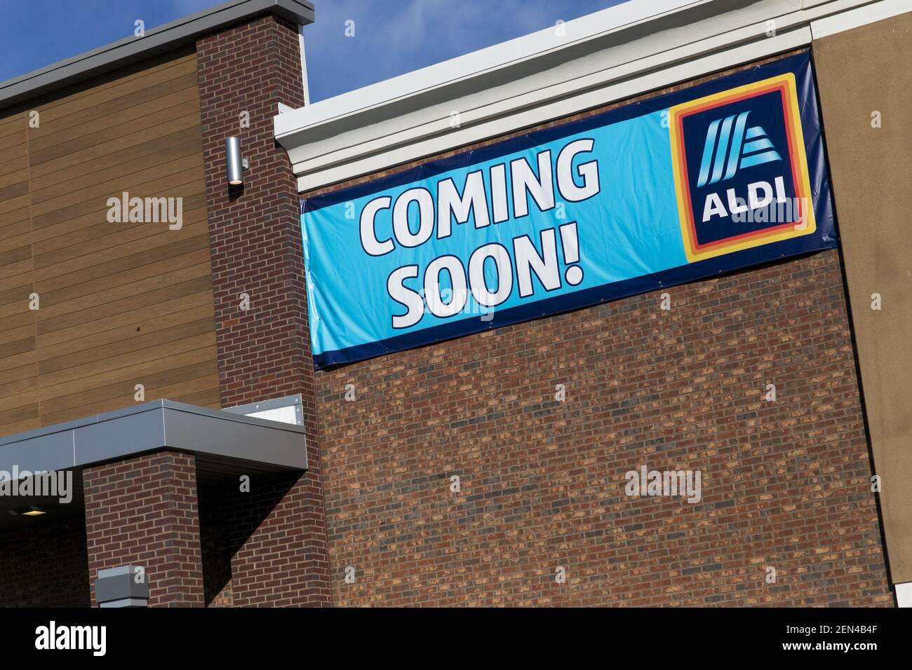 A logo sign outside of a Aldi retail grocery store location with a ...