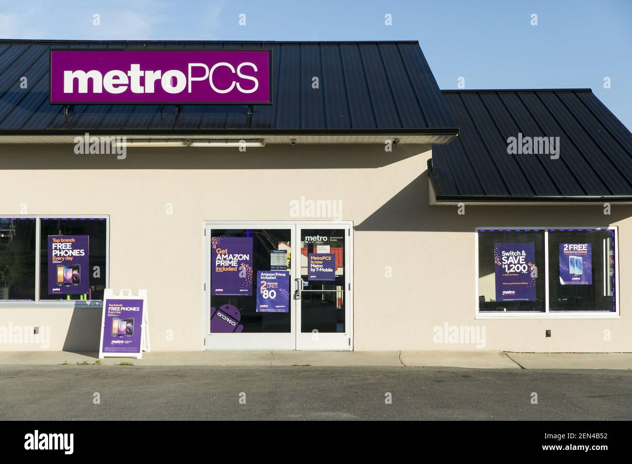 A logo sign outside of a MetroPCS Communications retail store location ...