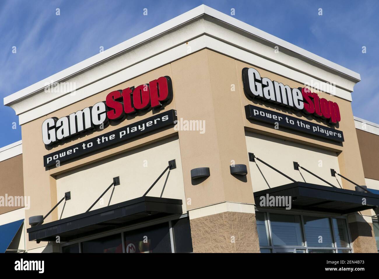A logo sign outside of a GameStop retail store location in Martinsburg ...