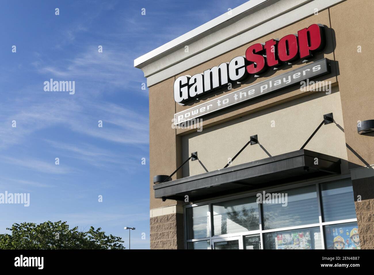A logo sign outside of a GameStop retail store location in Martinsburg ...