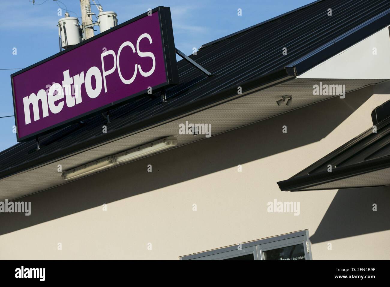 A logo sign outside of a MetroPCS Communications retail store location ...
