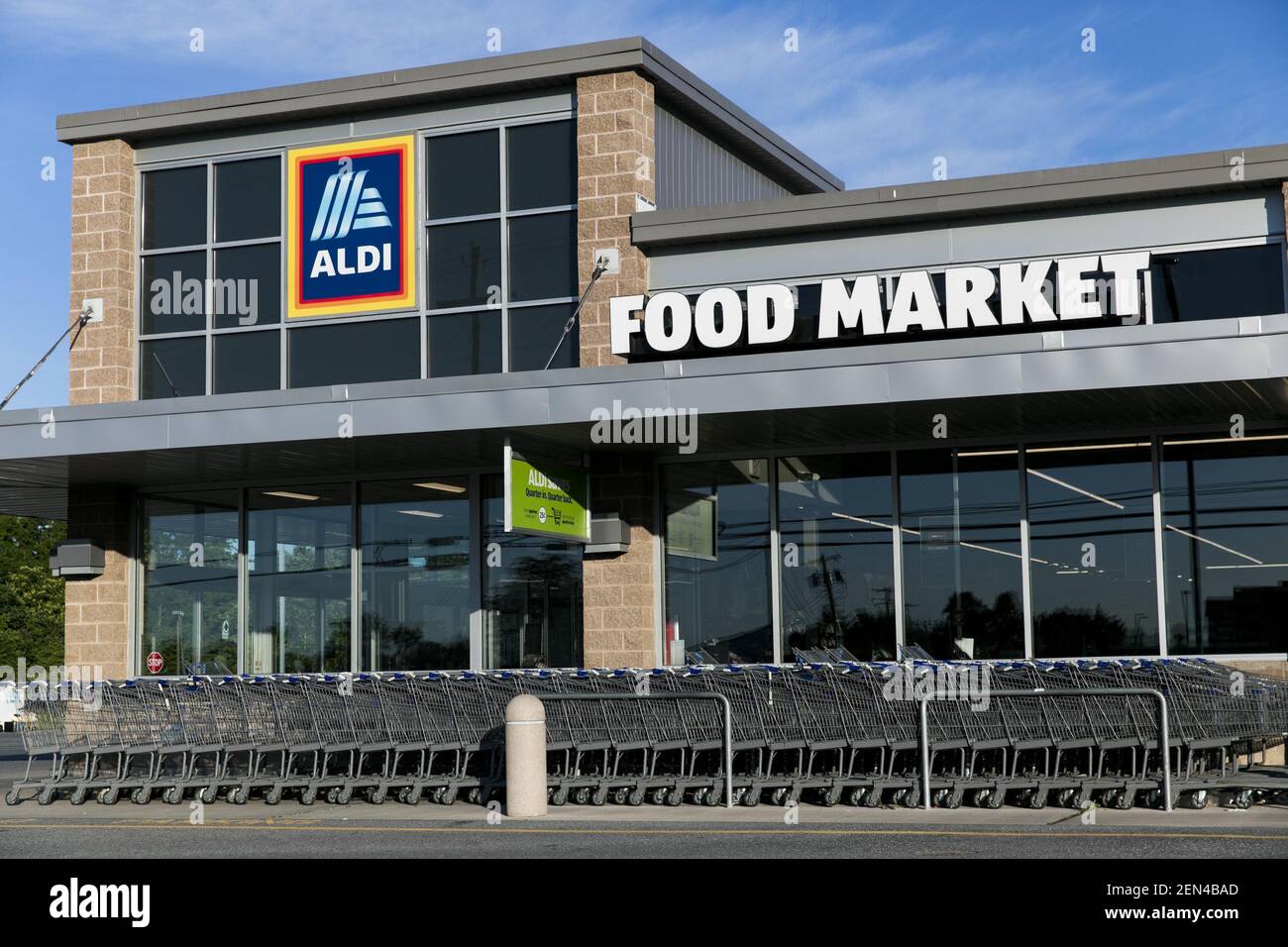 A logo sign outside of a Aldi retail grocery store location in ...