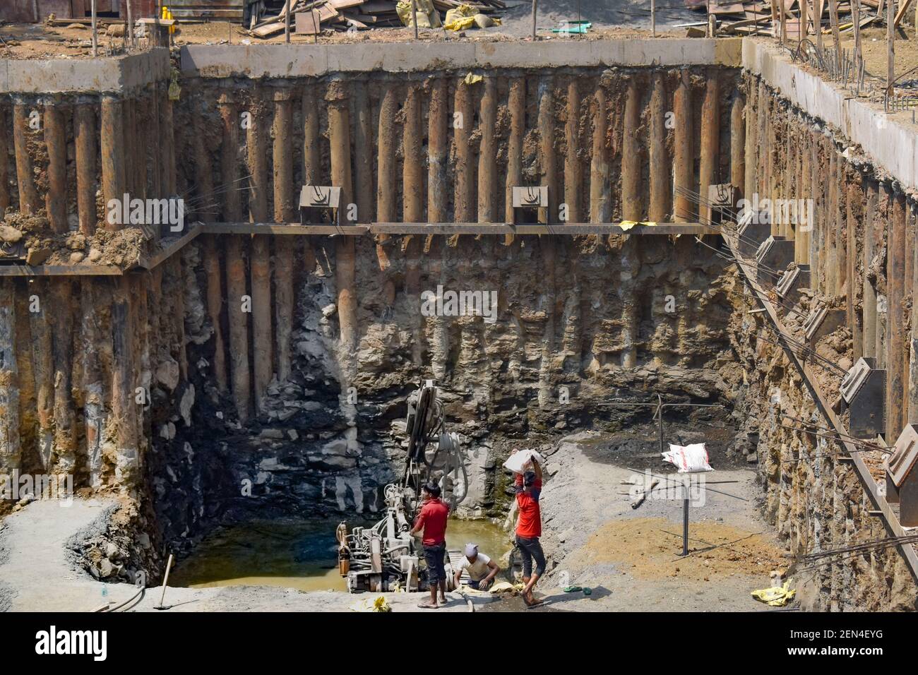 pile and lift foundation at construction building .Indian workers ...