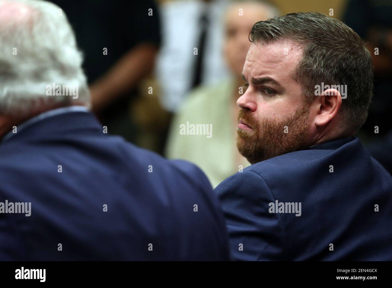 Prosecutor Chris Killoran turns to speak with prosecutor Tim Donnelly ...