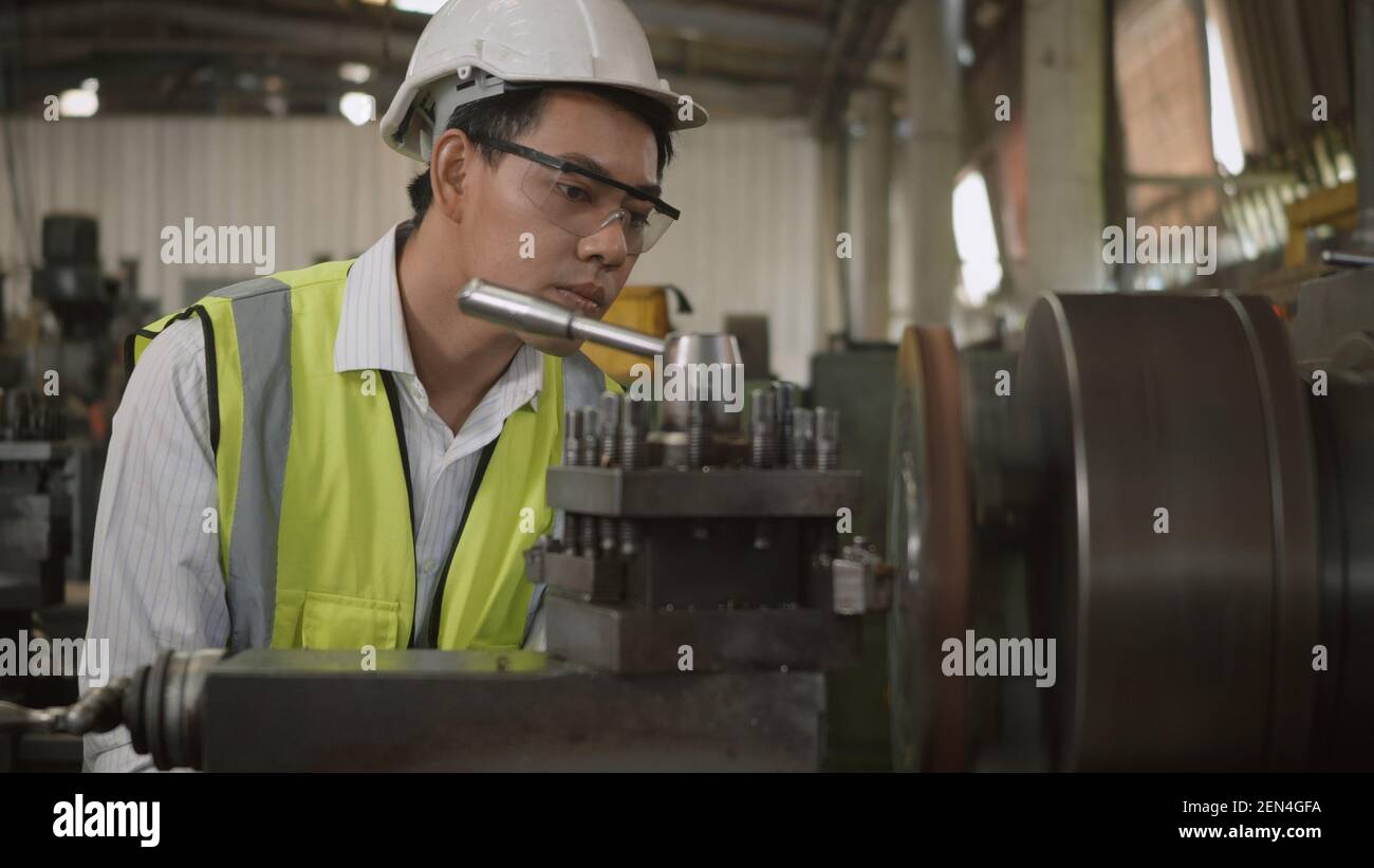 Asian professional mechanical engineer or operation man wear uniform ...