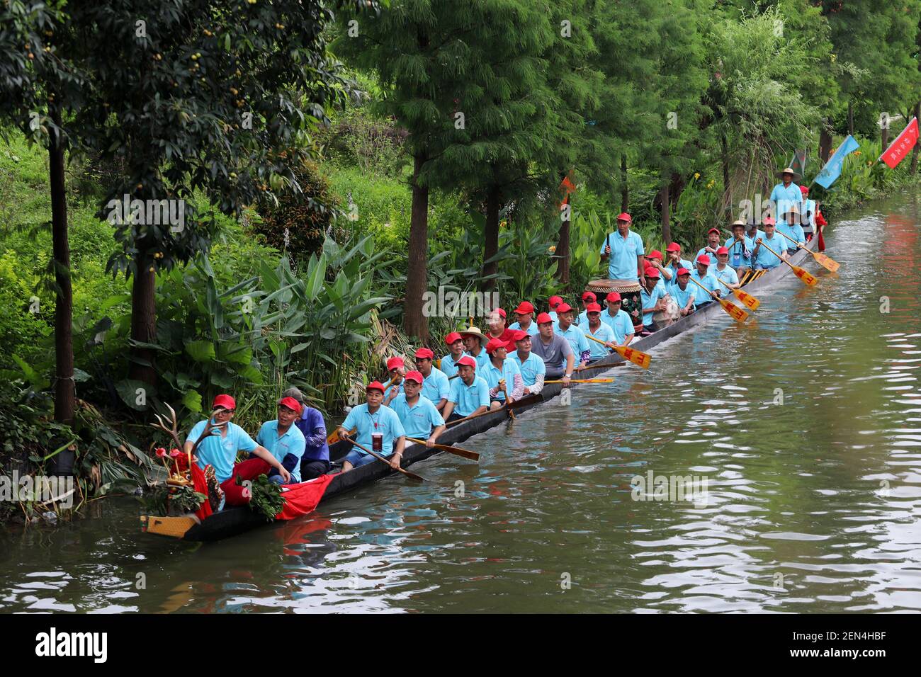 Chinese participants row a dragon boat during a festivity to celebrate ...