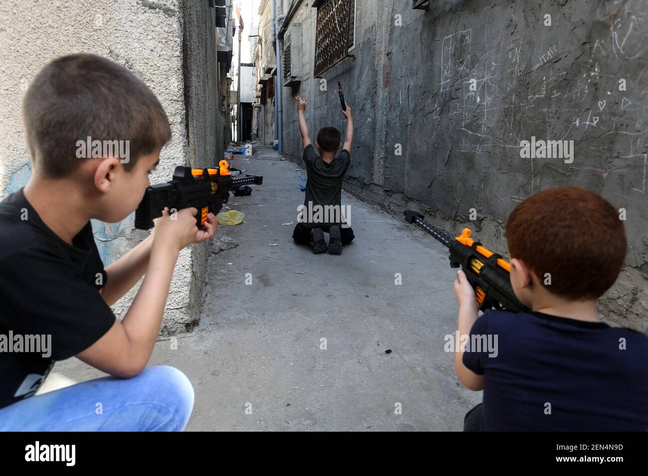 Palestinian boys playing with plastic weapons, children's favorite game ...