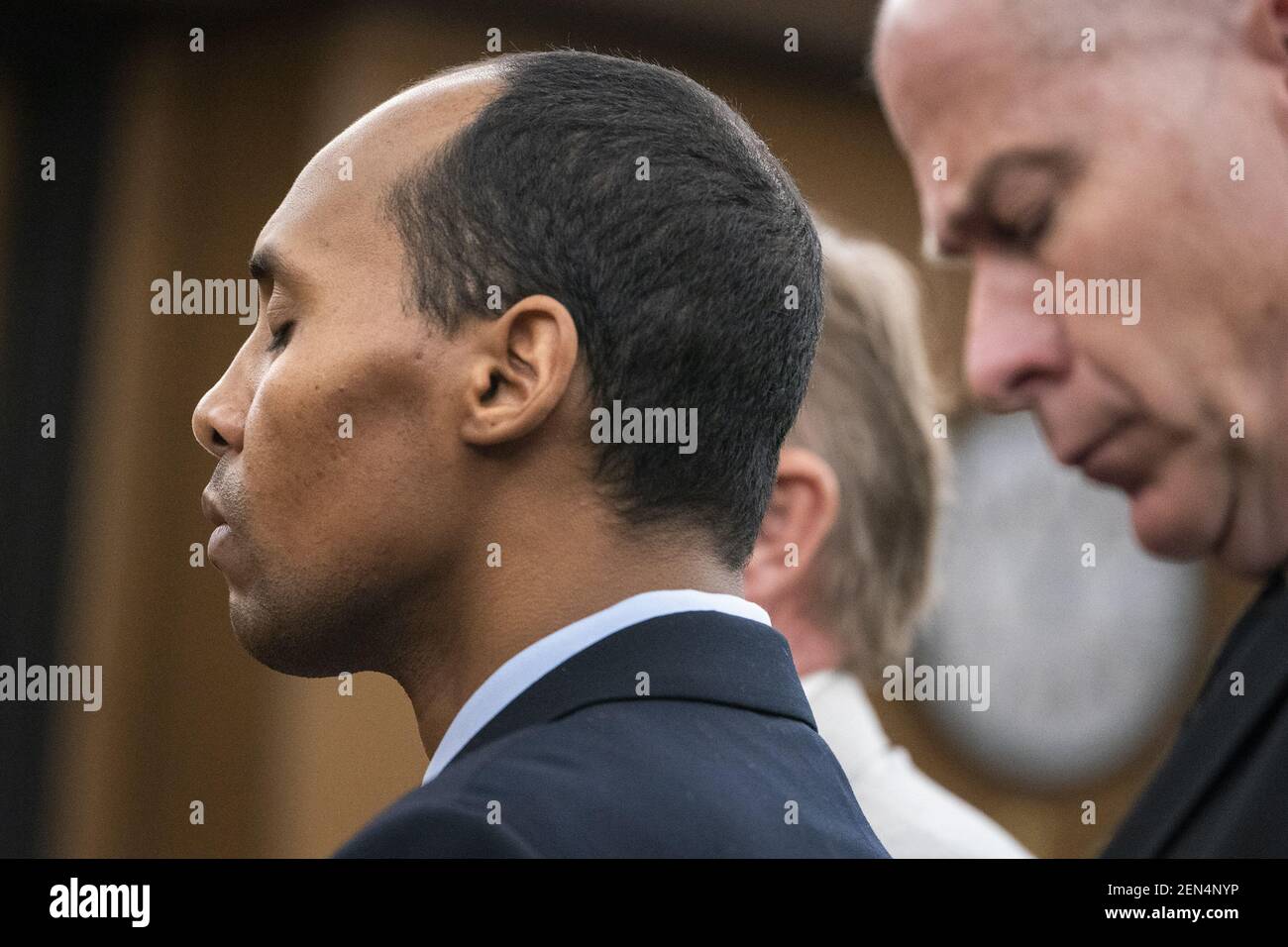 Mohamed Noor listens as he is sentenced by Judge Kathryn Quaintance ...