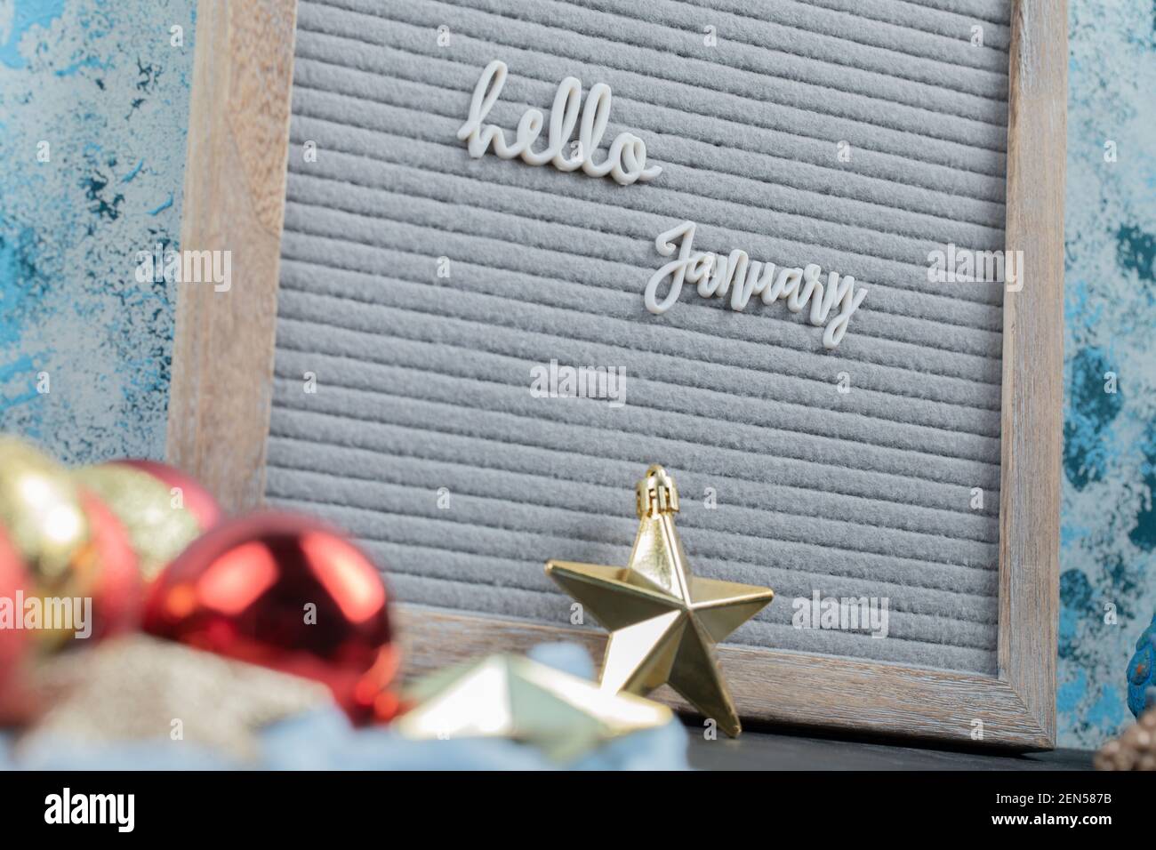 Happy january poster with christmas balls around Stock Photo - Alamy