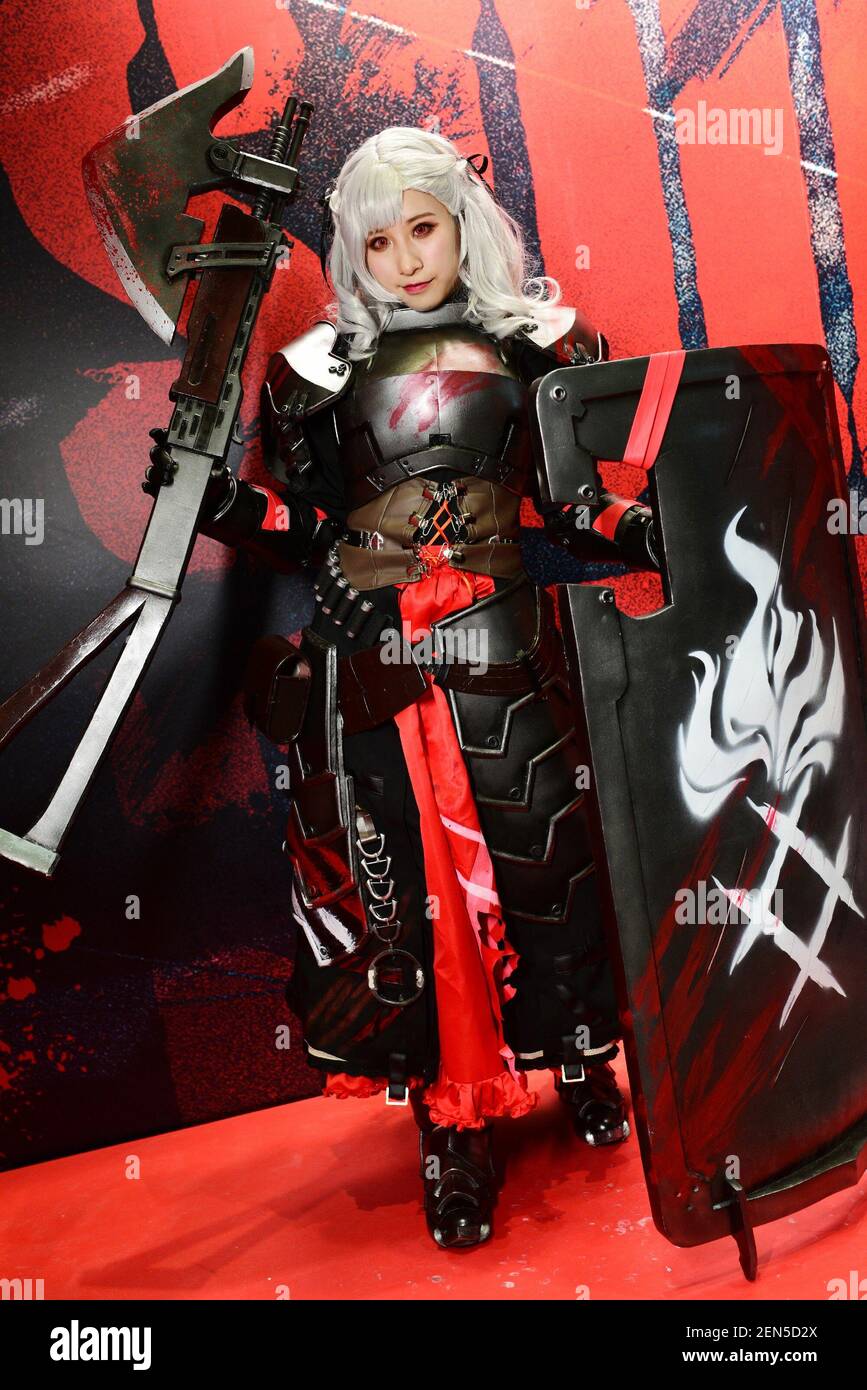 An entertainer dressed in cosplay costume poses during the Shanghai ...