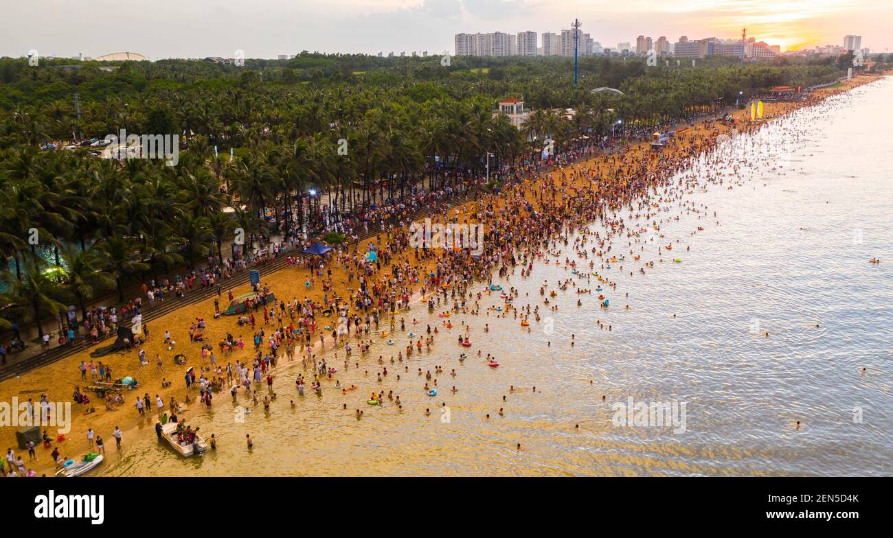 Holidaymakers crowd a beach resort to cool off during the traditional ...