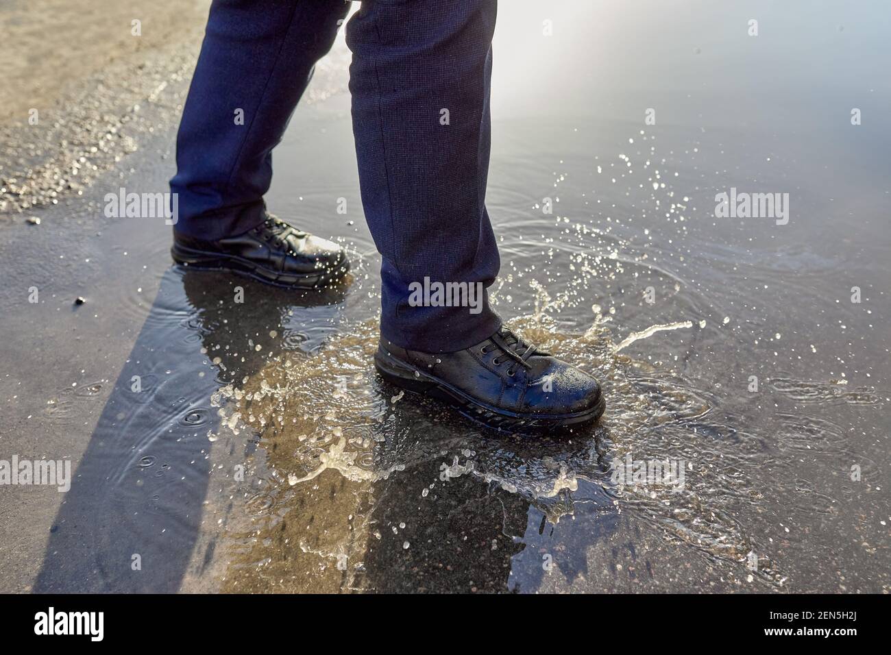 Shoe foot puddle hi-res stock photography and images - Alamy