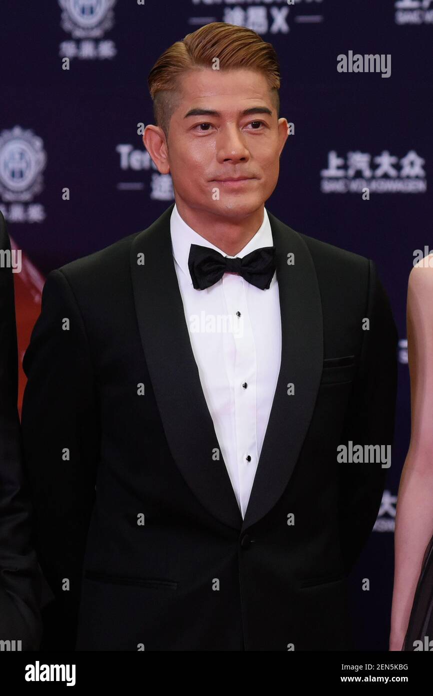 Hong Kong singer and actor Aaron Kwok poses as he arrives on the red carpet for the 25th Huading ...
