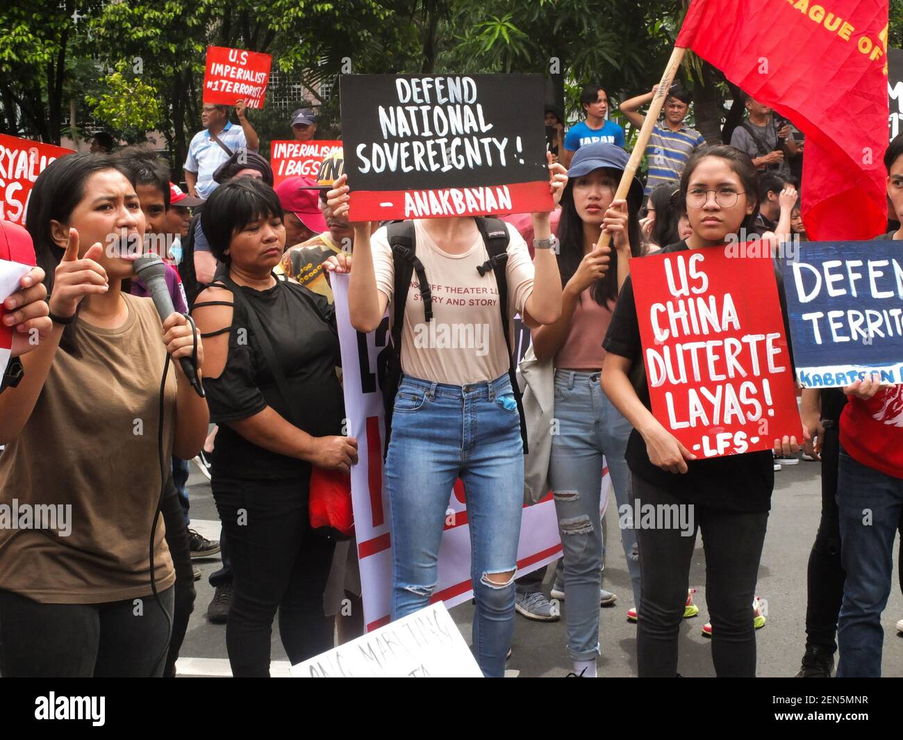Female students hold placards during the independence day protest. The ...