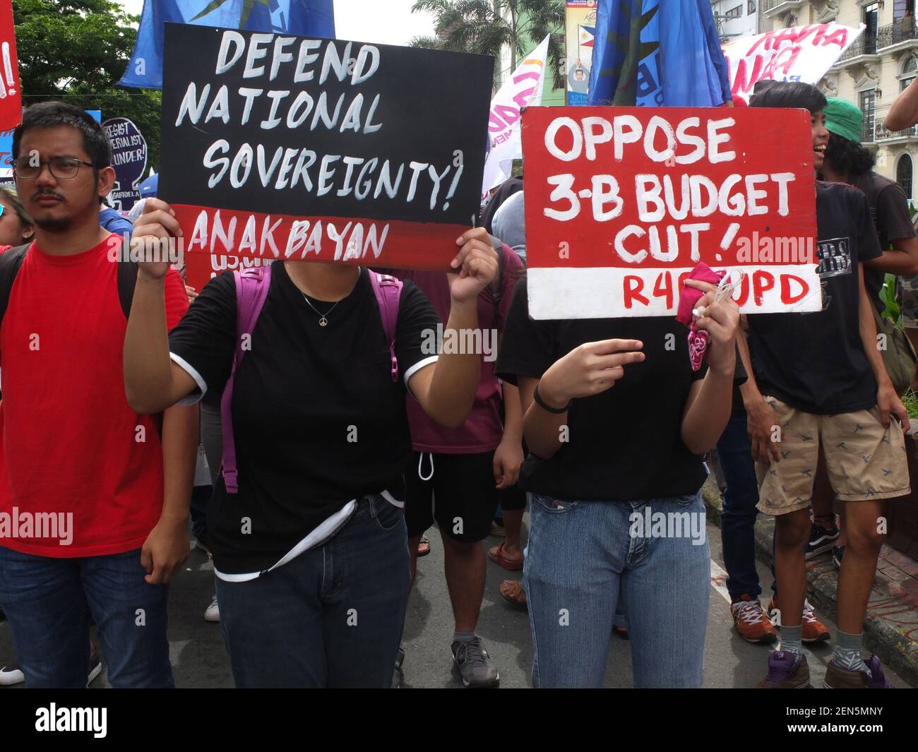 Members of several cause oriented groups hold placards during the ...