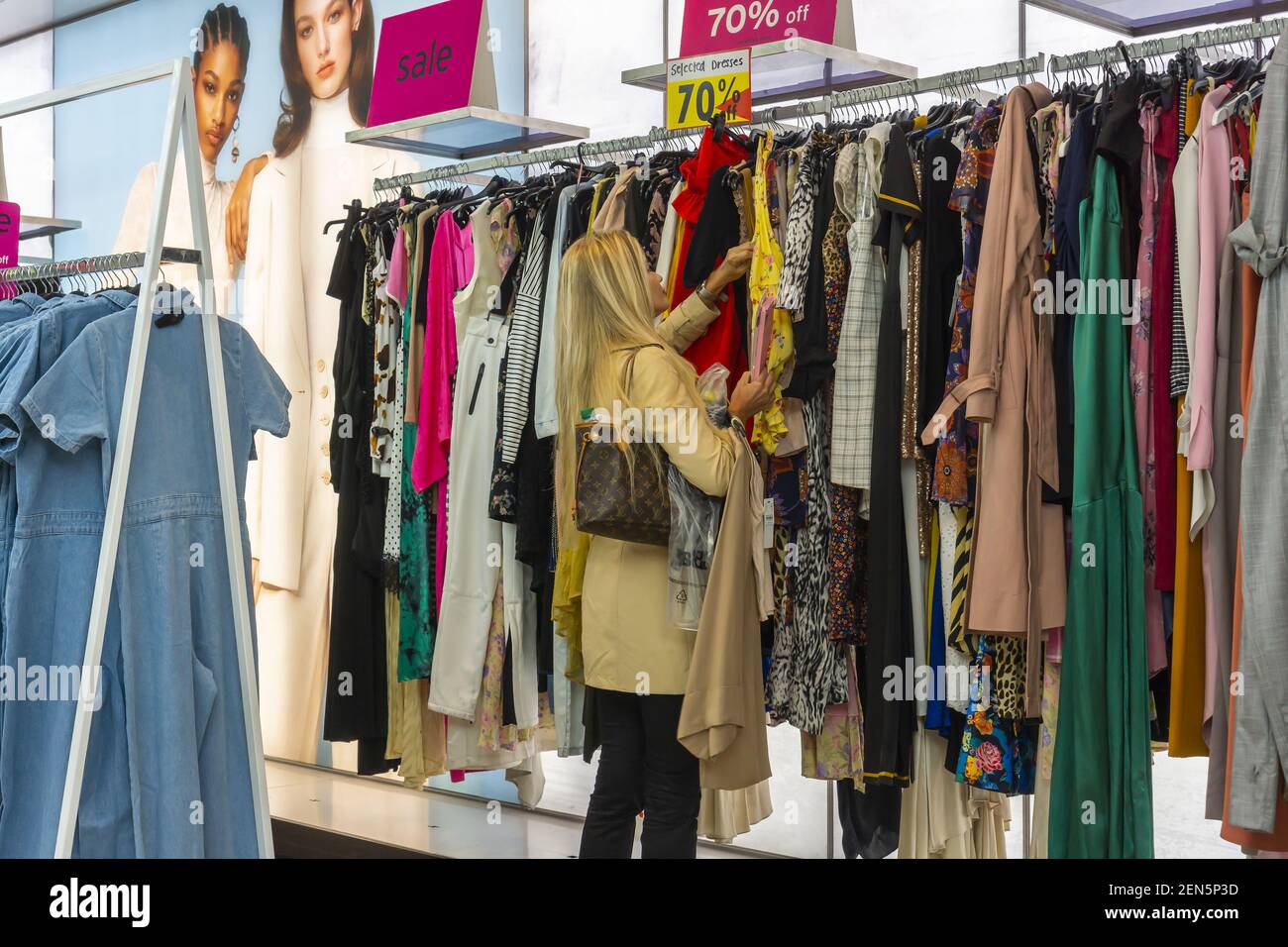 Shoppers browse the sales at the TopShop/TopMan store on Fifth Avenue ...