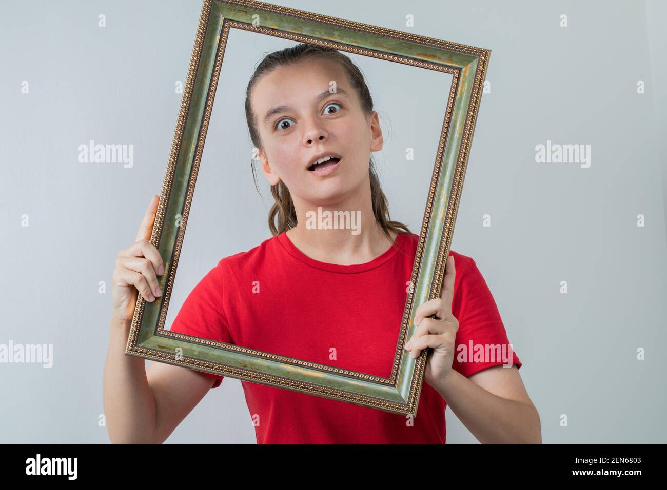 A model holding a metallic photo frame Stock Photo - Alamy