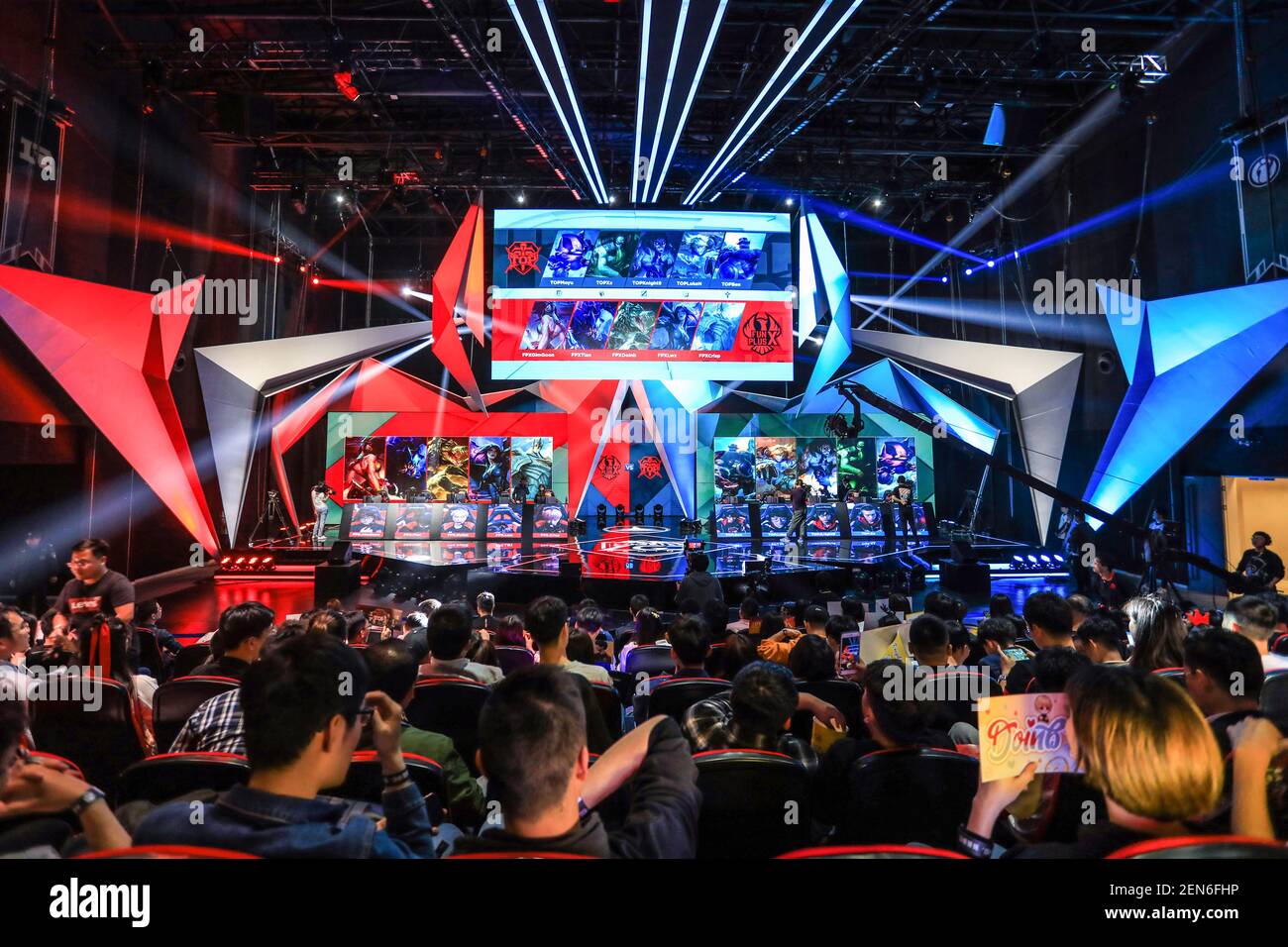 Players of FunPlus Phoenix (FPX) and Topsports Gaming compete in their ...
