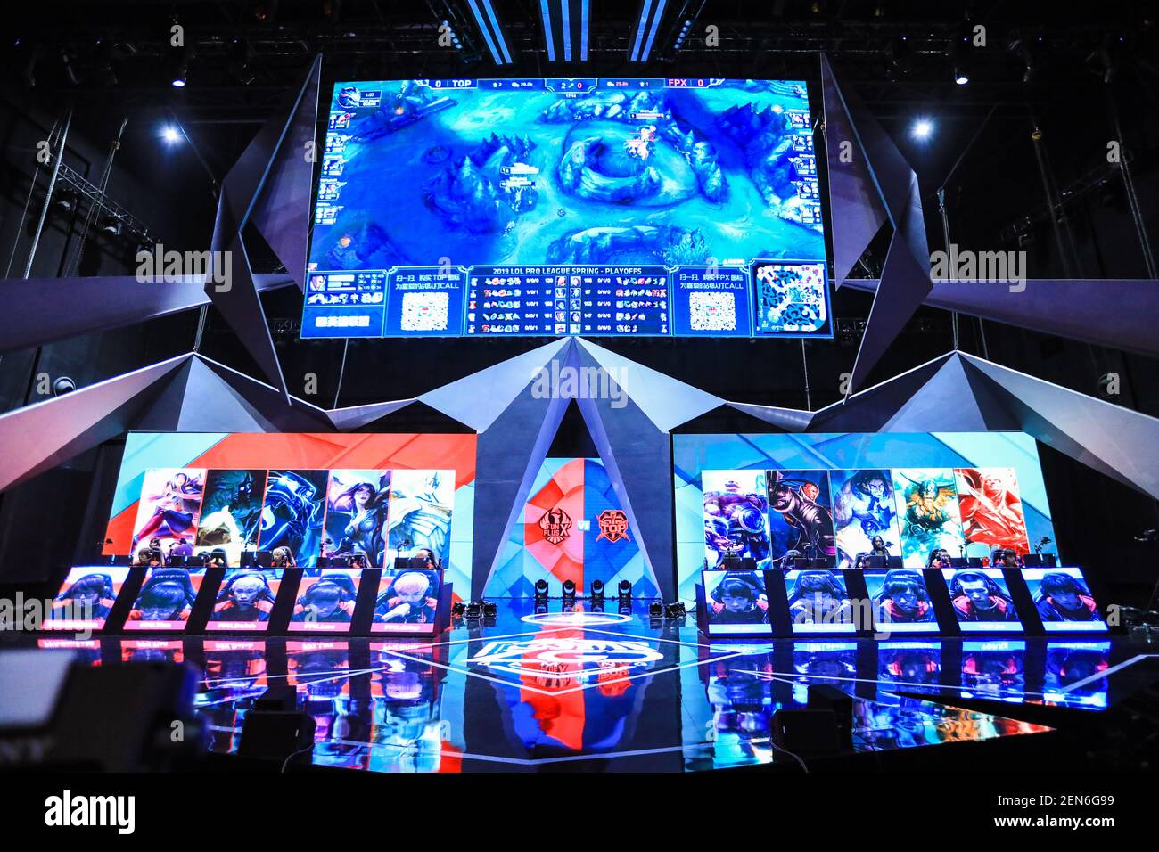 Players of FunPlus Phoenix (FPX) and Topsports Gaming compete in their ...