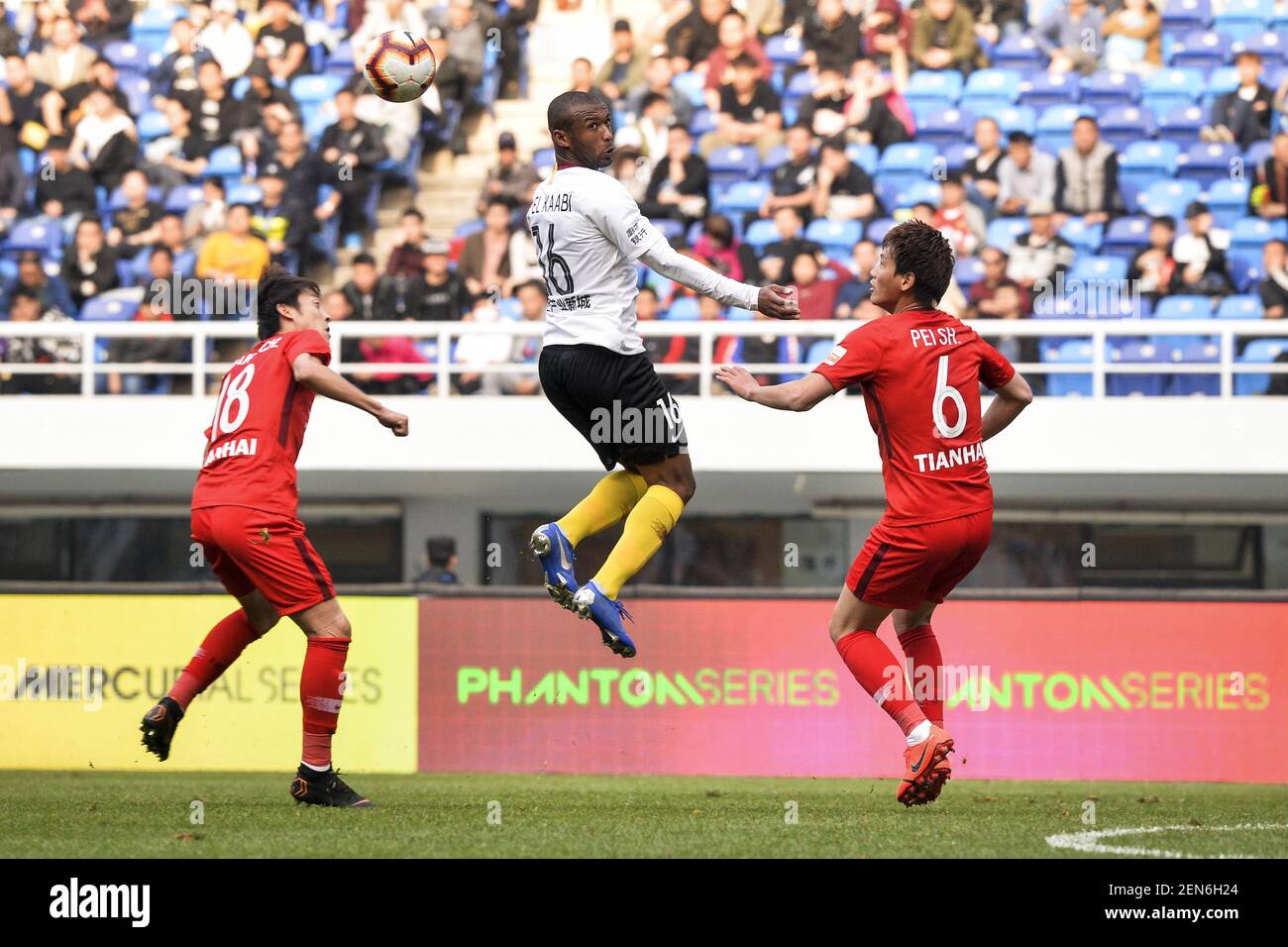 Moroccan football player Ayoub El Kaabi, top, of Hebei China Fortune ...