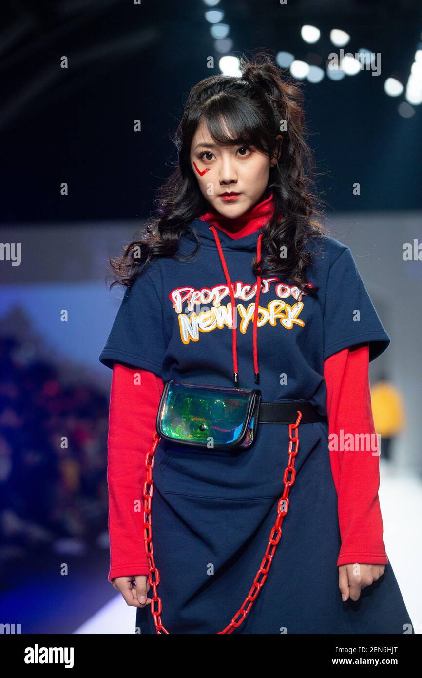 Singer Li Yitong of Chinese idol group SNH48 displays a new creation at ...