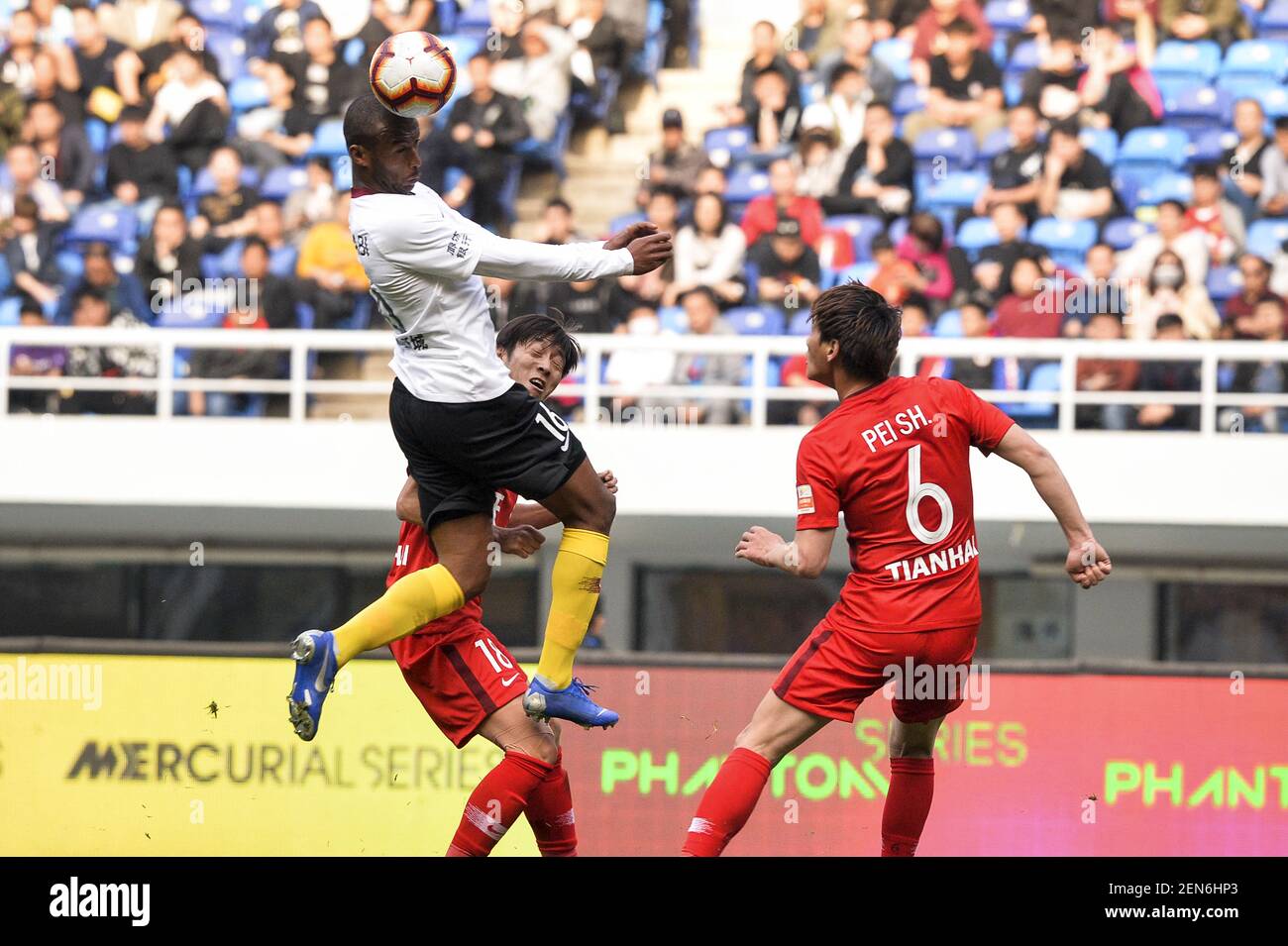 Moroccan football player Ayoub El Kaabi, top, of Hebei China Fortune ...