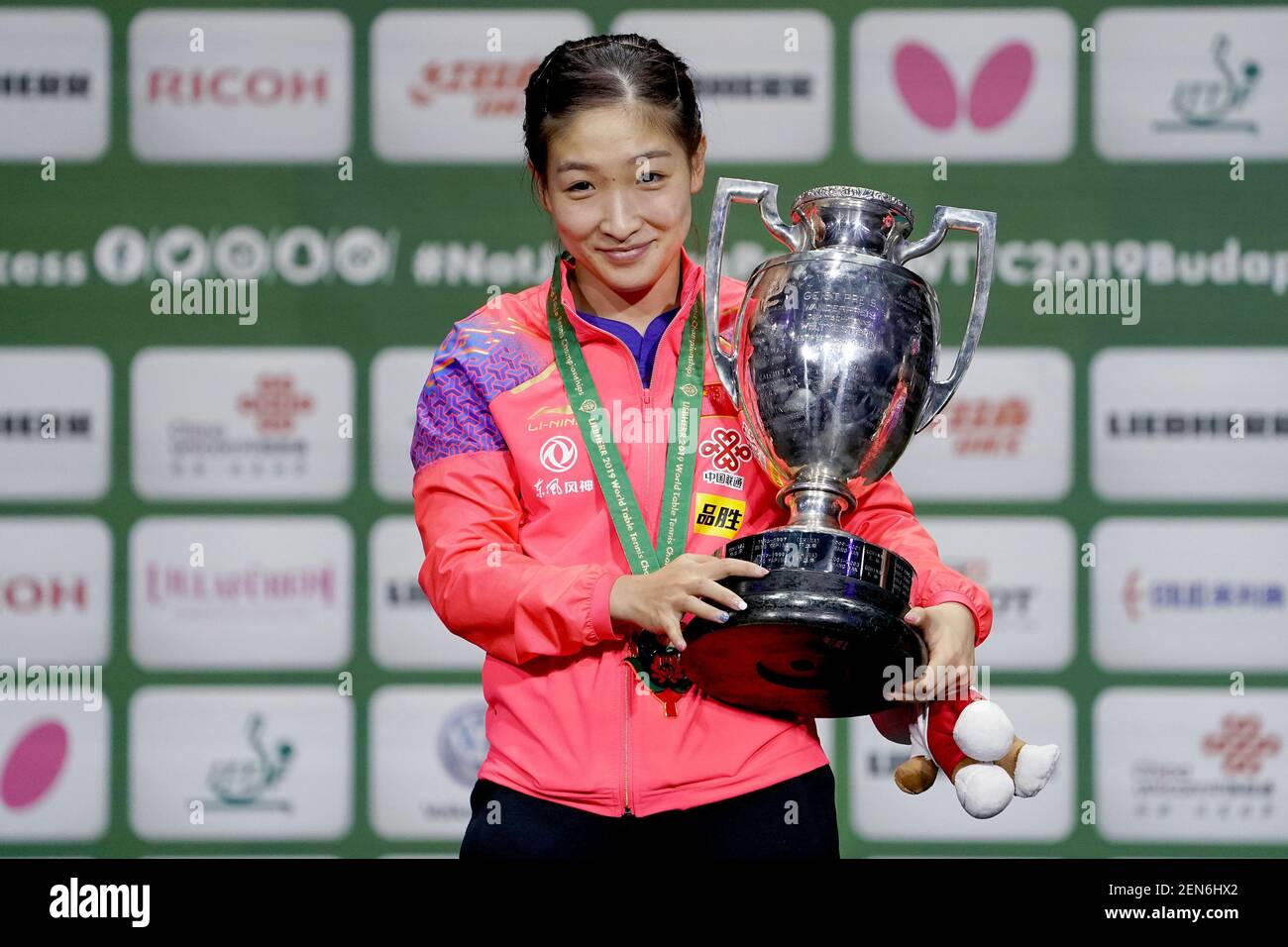 Liu Shiwen of China poses with her trophy after defeating Chen Meng of ...