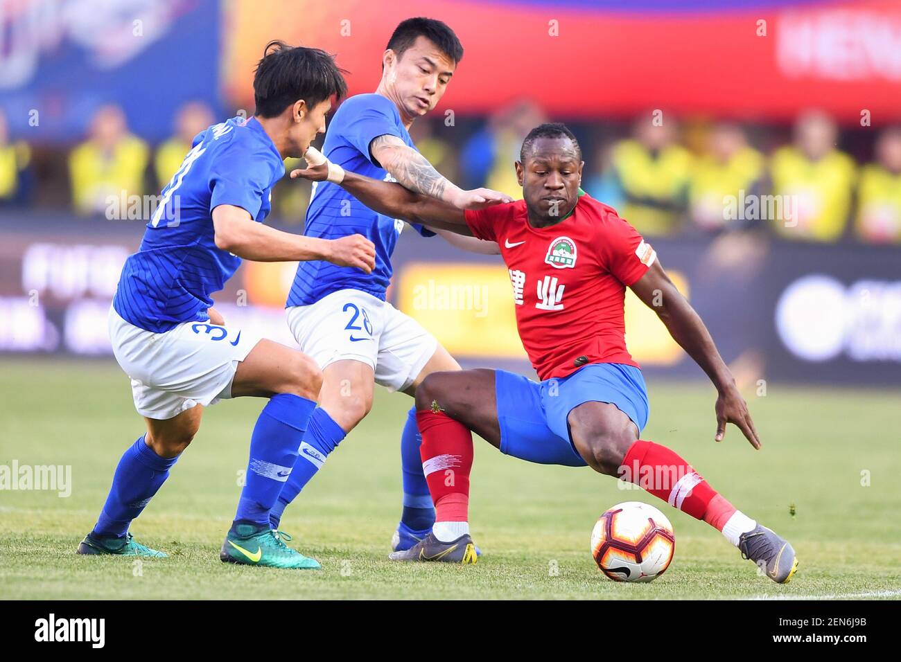 Cameroonian football player Christian Bassogog, right, of Henan Jianye ...