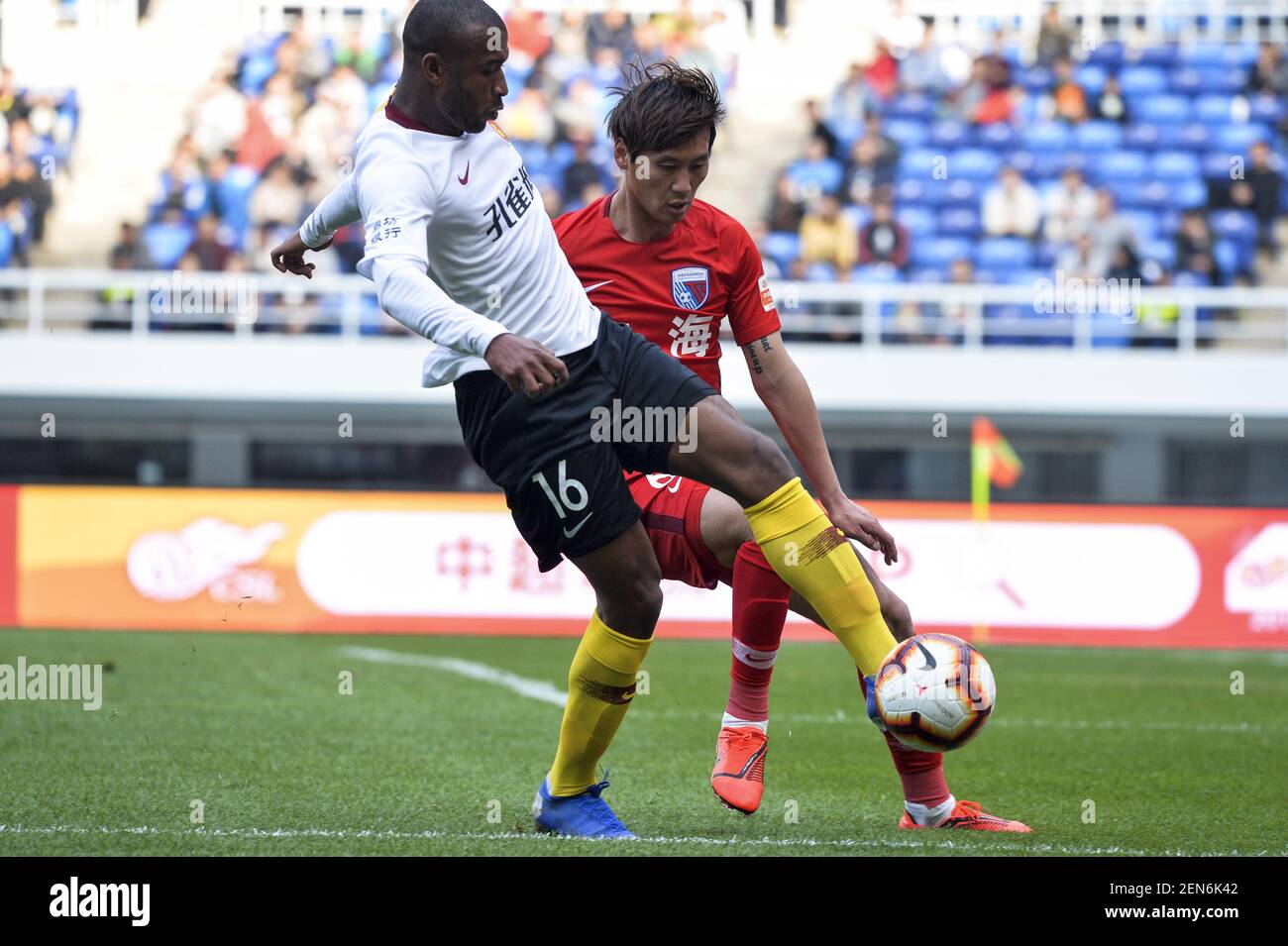 Moroccan football player Ayoub El Kaabi, left, of Hebei China Fortune ...