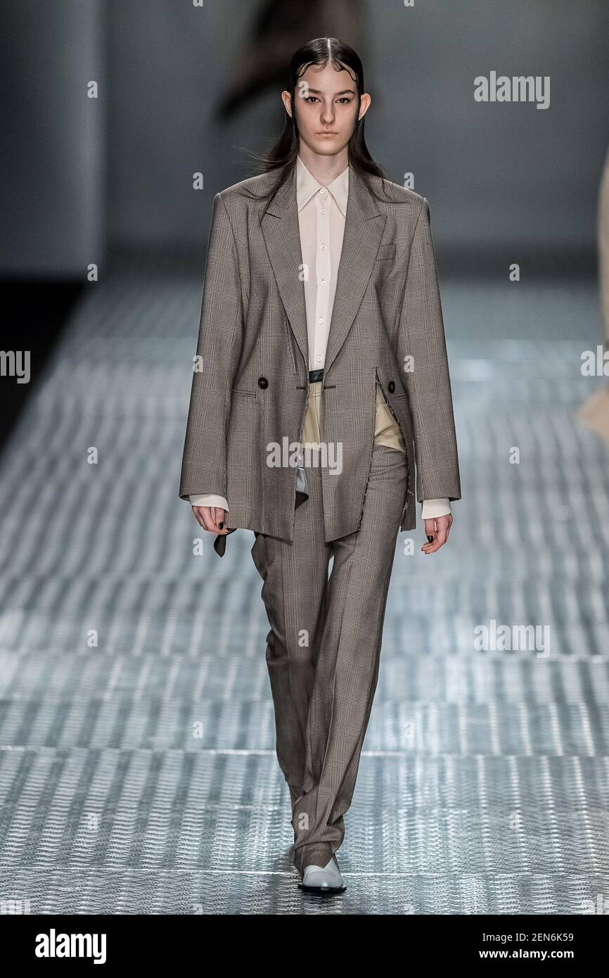 A model displays a new creation at the YOEYYOU show during the Shanghai ...