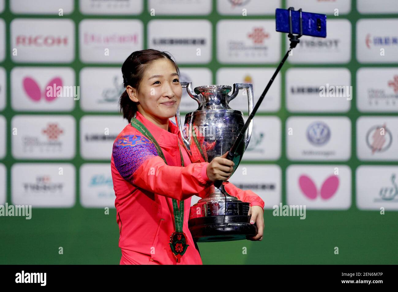 Liu Shiwen of China poses with her trophy after defeating Chen Meng of ...
