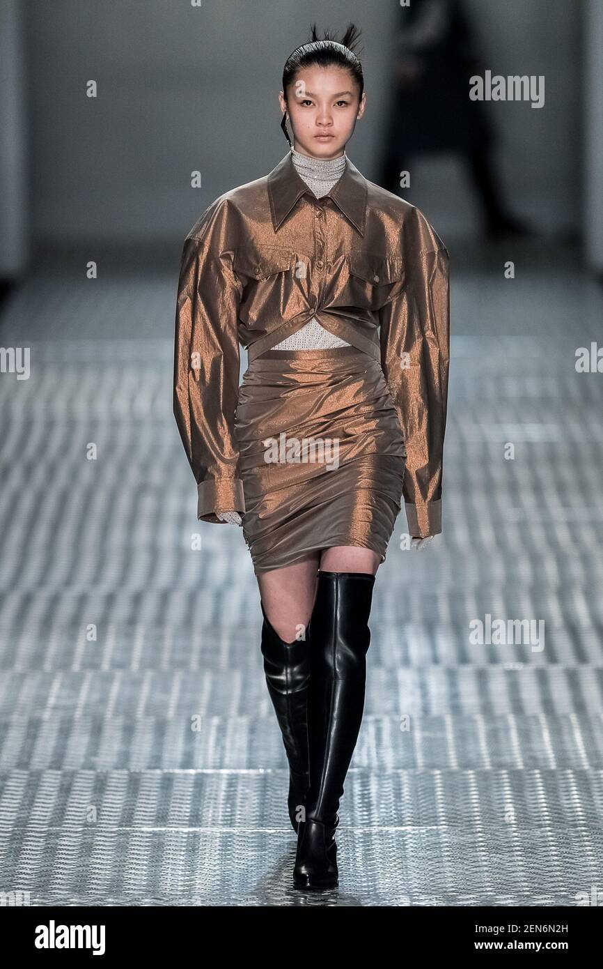 A model displays a new creation at the YOEYYOU show during the Shanghai ...