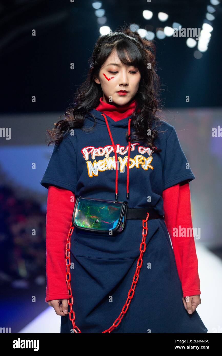 Singer Li Yitong of Chinese idol group SNH48 displays a new creation at ...