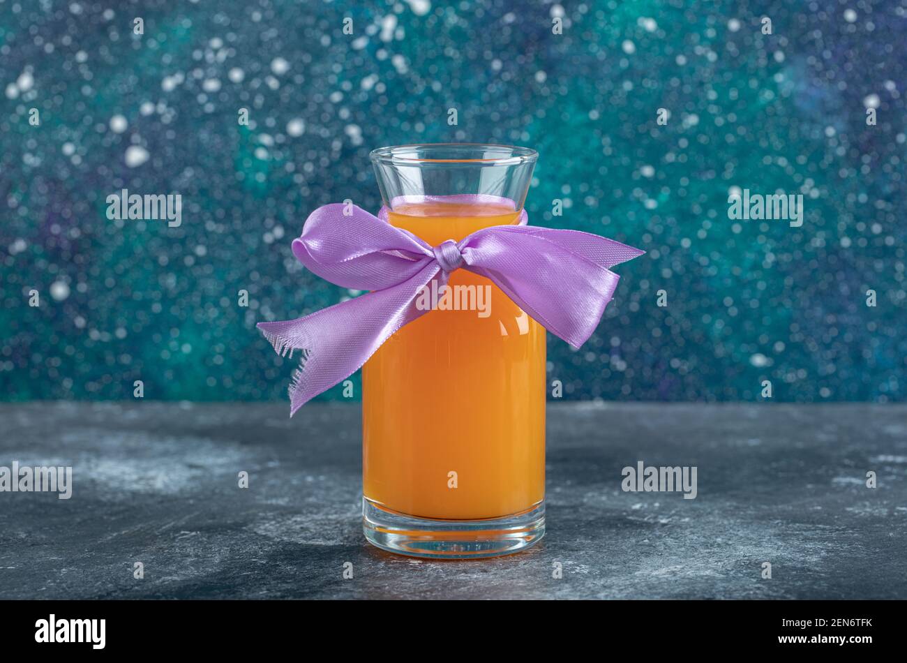 Glass of orange juice on marble background Stock Photo - Alamy