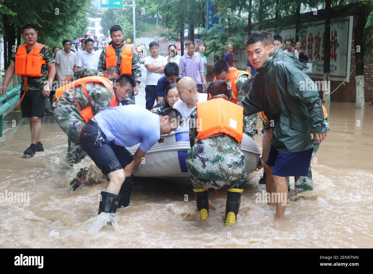 Chinese rescuers evacuate local residents in floodwater caused by a ...