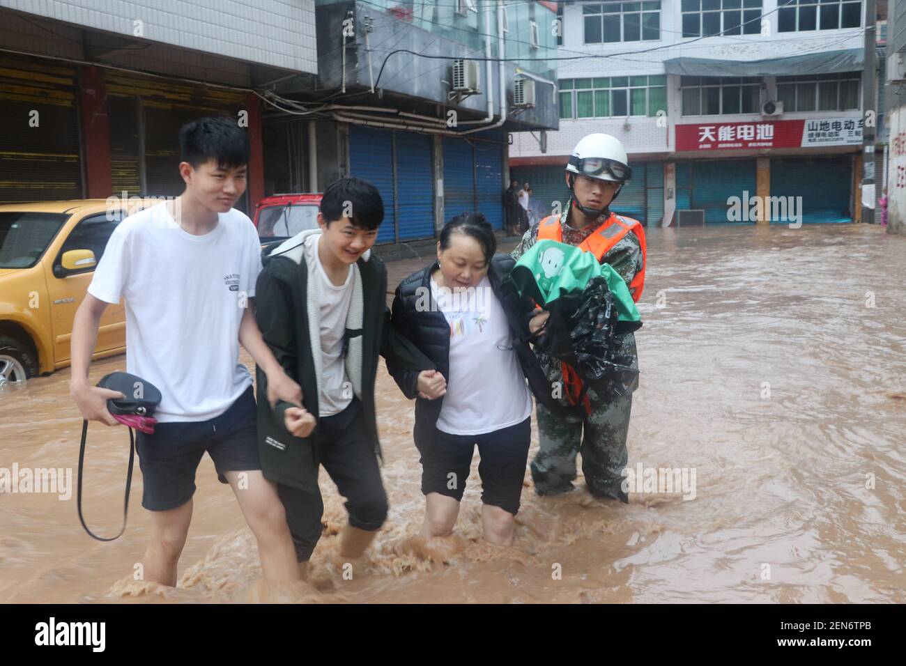 Chinese rescuers evacuate local residents in floodwater caused by a ...