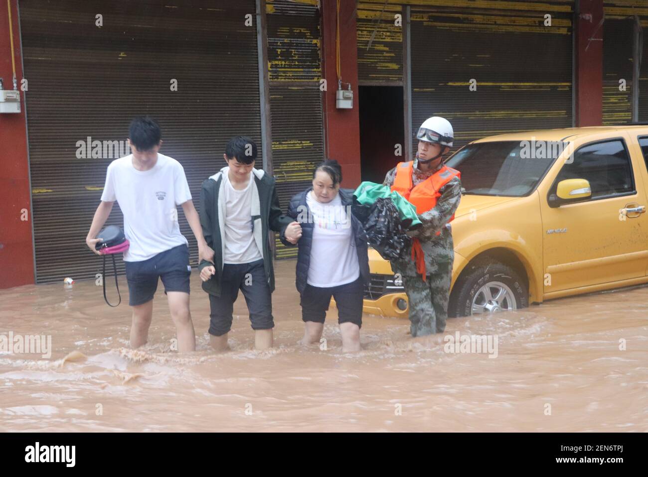 Chinese rescuers evacuate local residents in floodwater caused by a ...